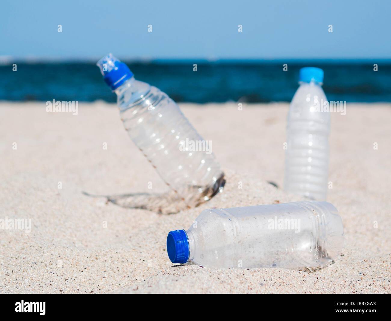 Plastic waste empty bottle sand beach Stock Photo - Alamy