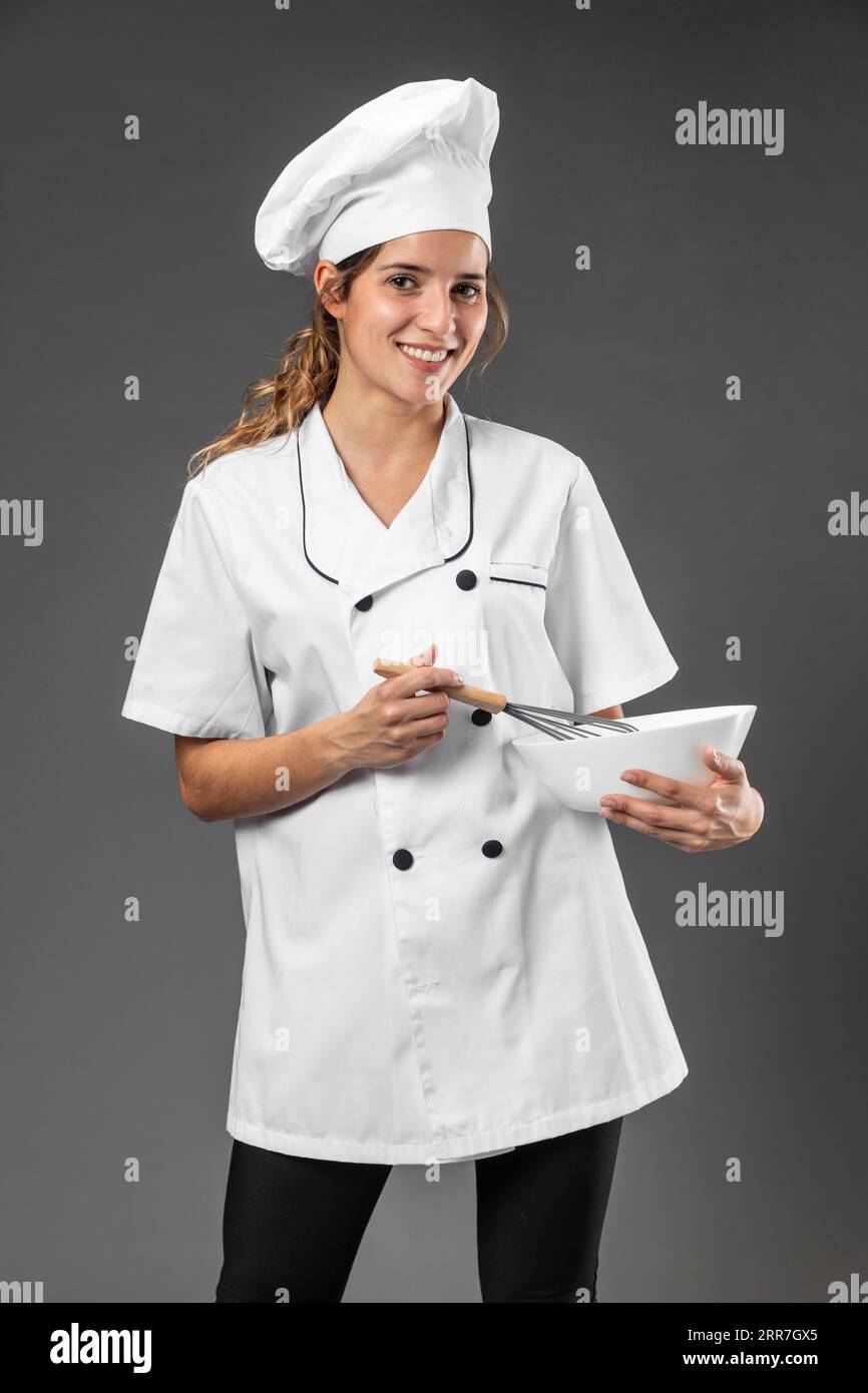 Portrait female chef with bowl mixing Stock Photo - Alamy