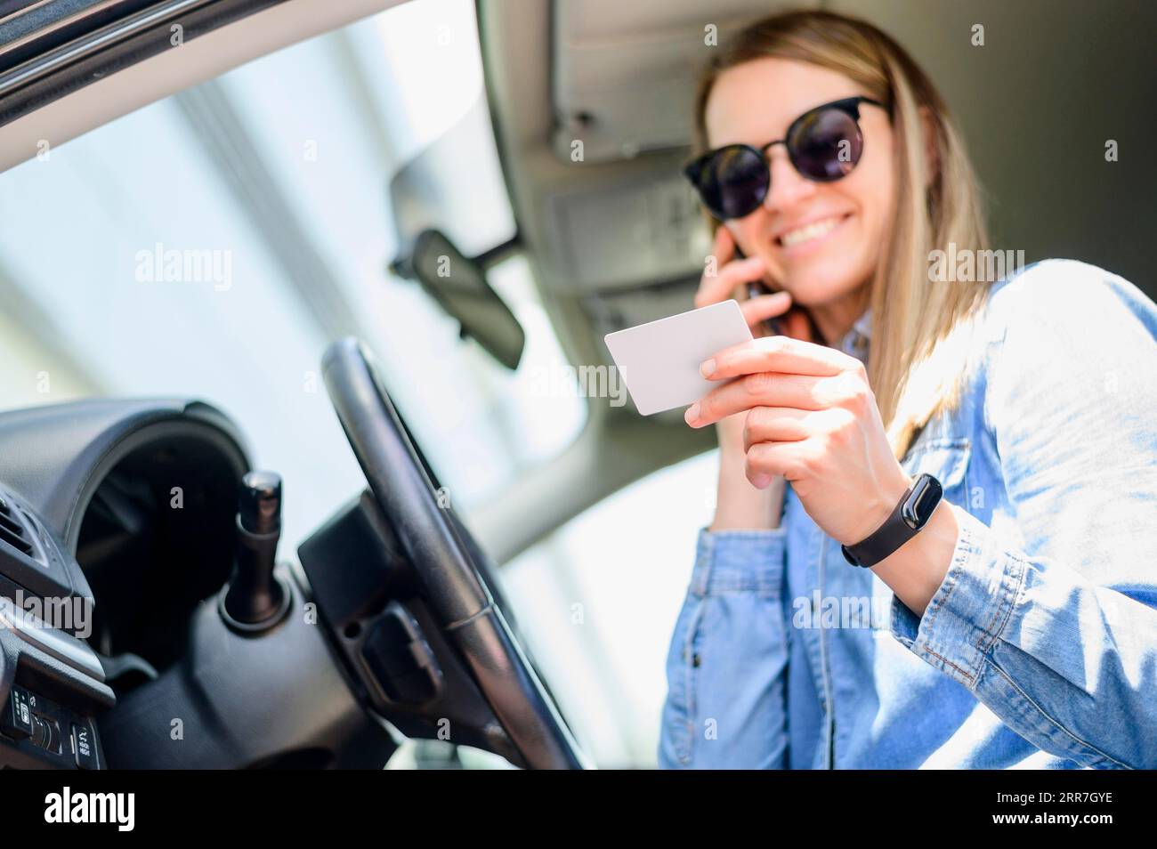 Portrait smiley woman giving card details Stock Photo - Alamy