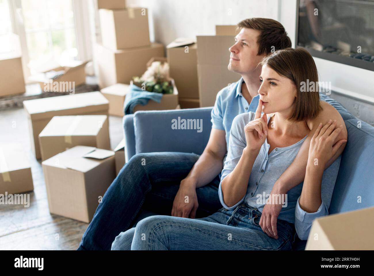 Side view couple couch getting things ready move out Stock Photo - Alamy