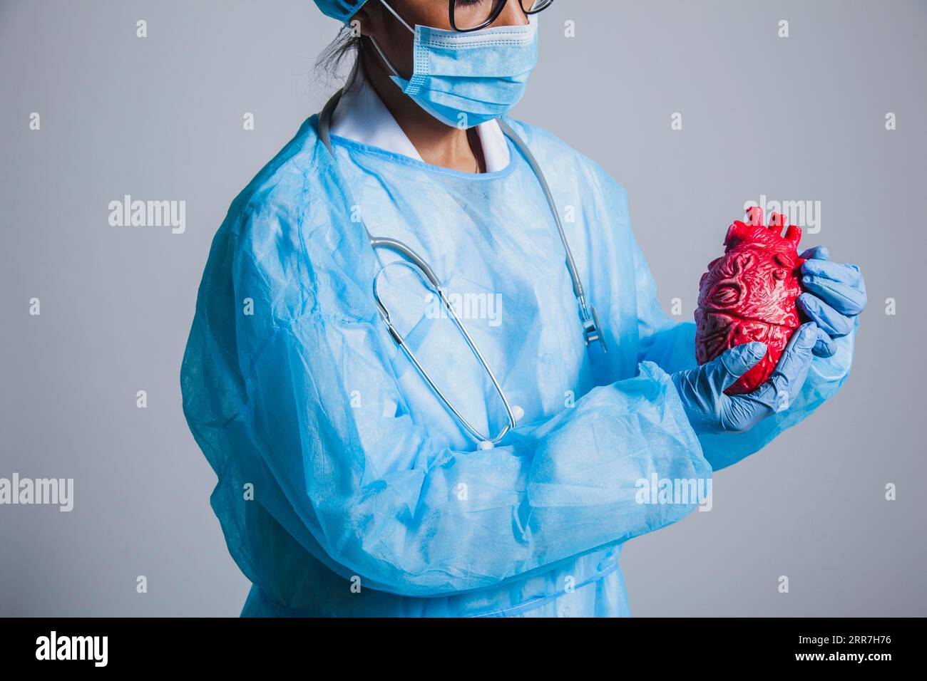 Surgeon posing with heart Stock Photo - Alamy
