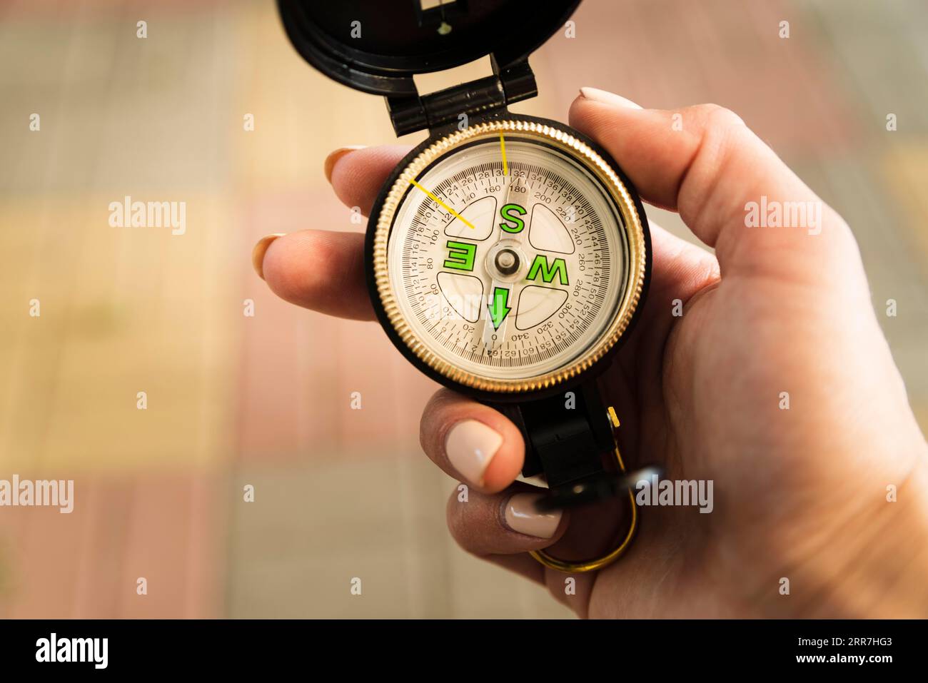 Tourist looking his compass Stock Photo - Alamy