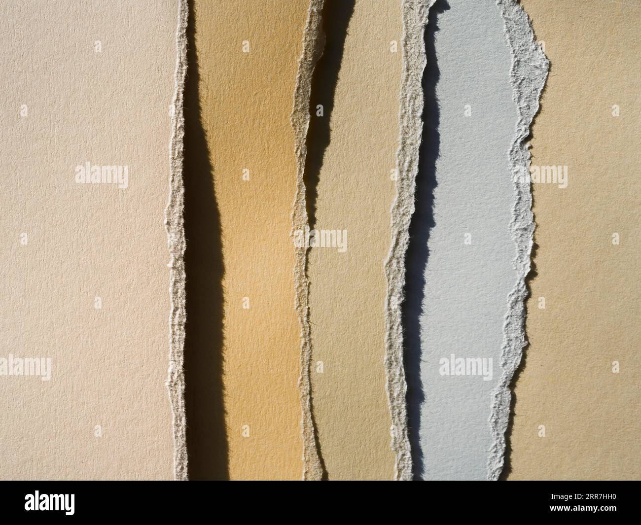 Vertical tears colored paper Stock Photo - Alamy