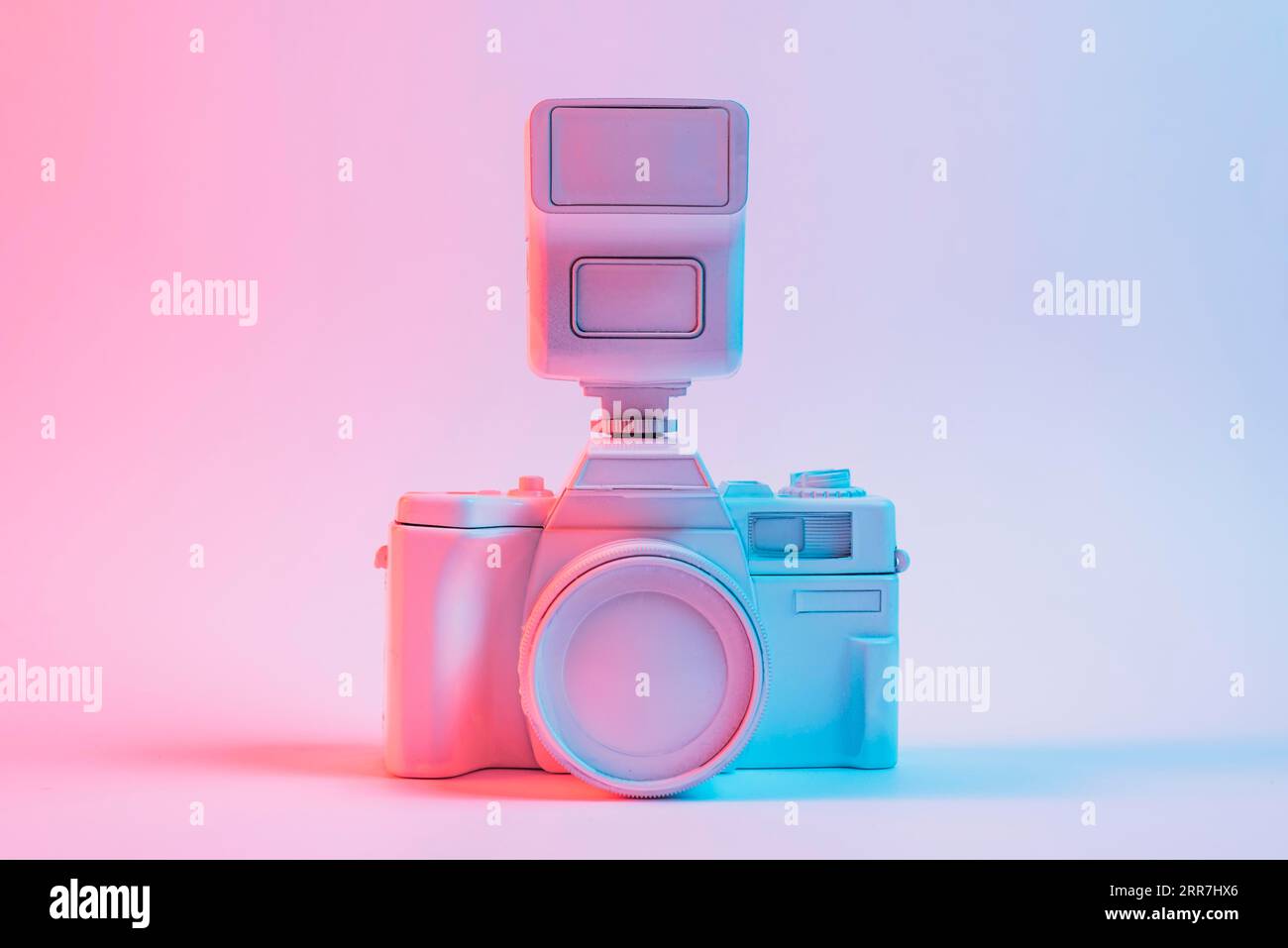 Blue light vintage painted pink camera against pink backdrop Stock ...