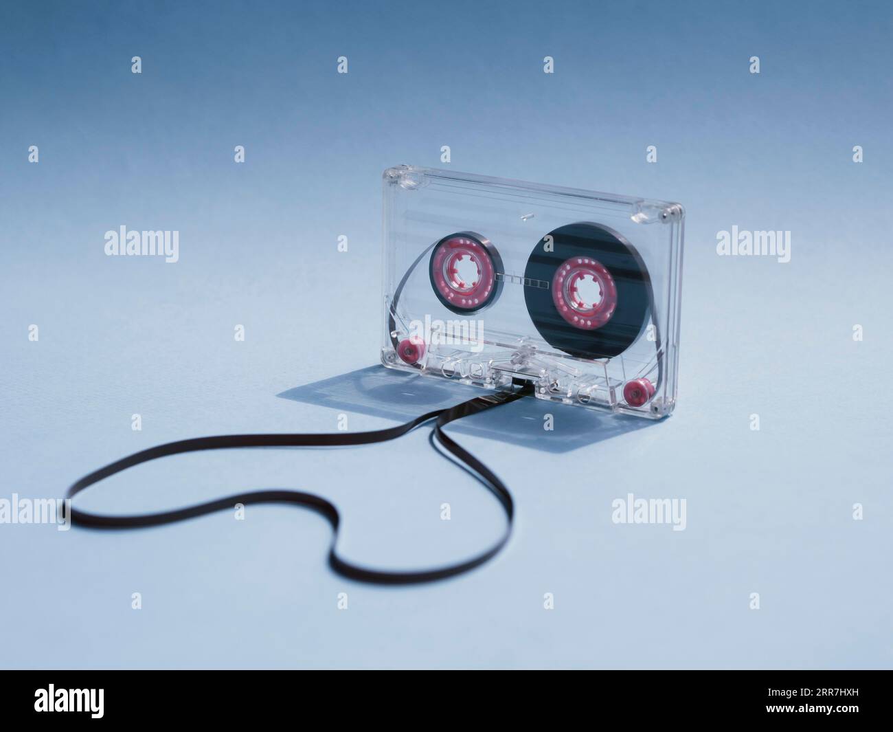 Close up shot clear cassette tape gradient background Stock Photo - Alamy