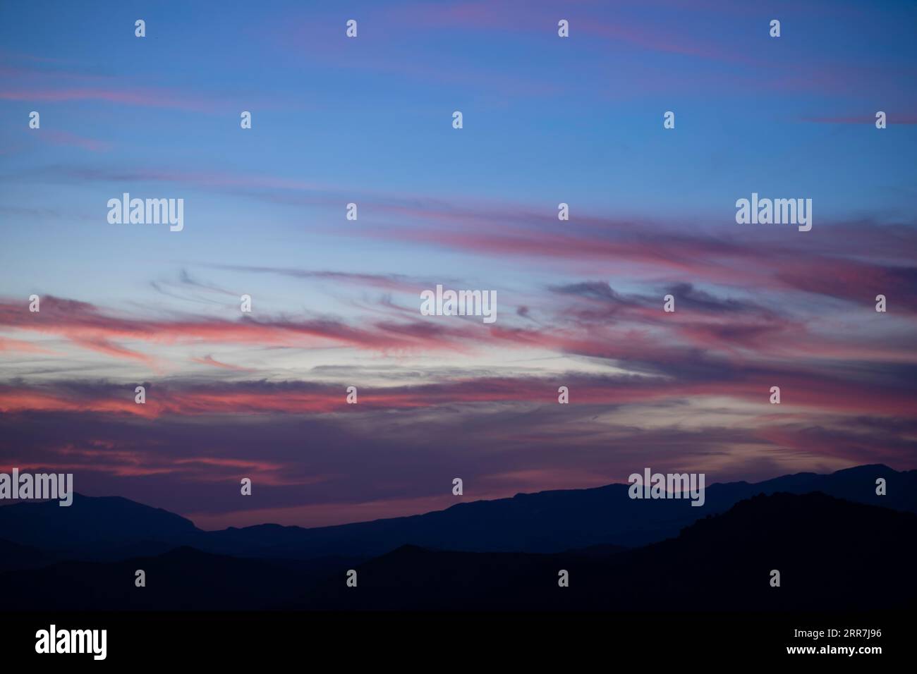 (Cumulus) sunset clouds with sun setting down dark background Stock ...