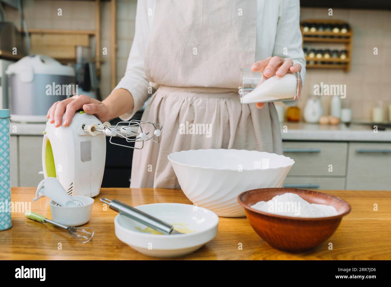 Female chef preparing pie kitchen with ingredients table Stock Photo ...