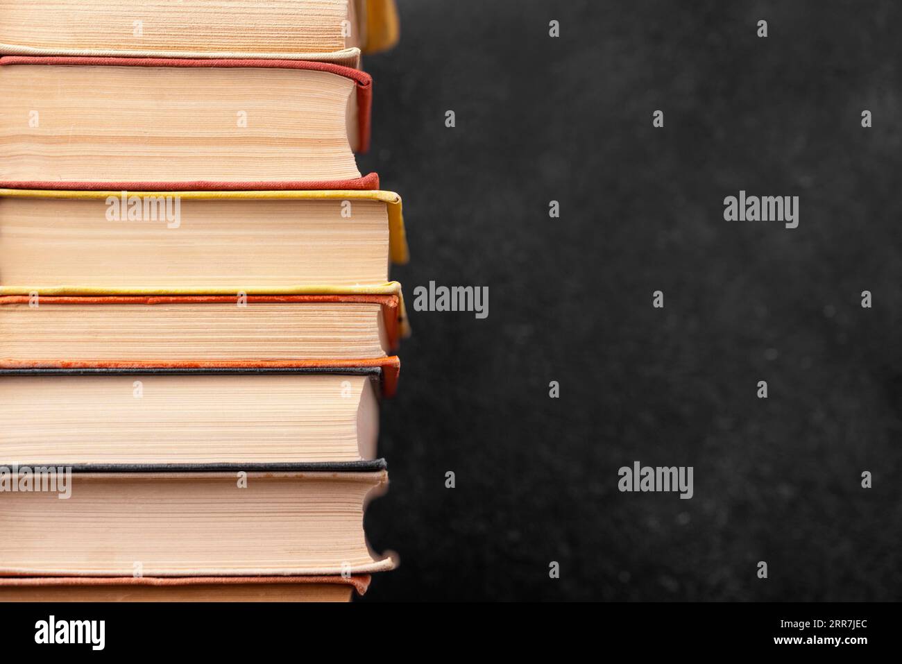 Front view stack different books with copy space Stock Photo - Alamy