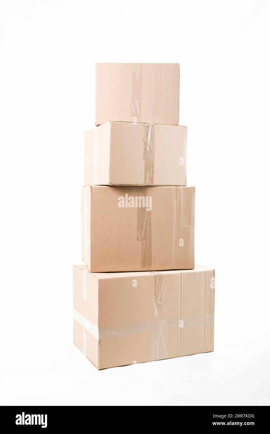 Stacked cardboard boxes isolated white background Stock Photo - Alamy