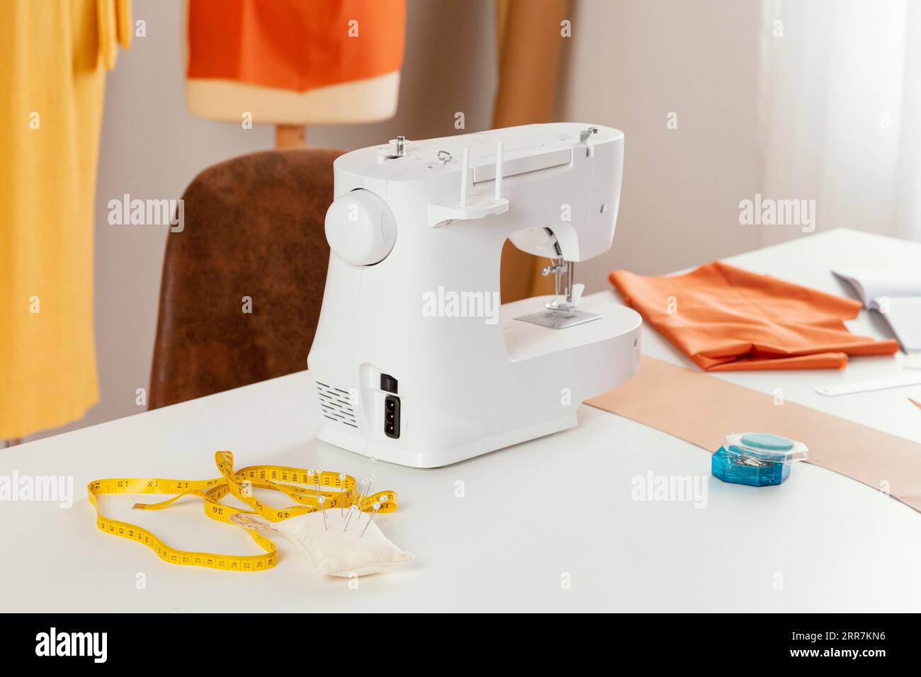Workspace concept with sewing machine Stock Photo - Alamy