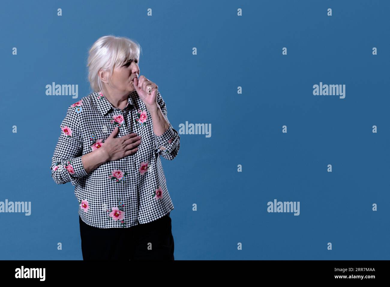 Elderly woman is coughing Stock Photo - Alamy