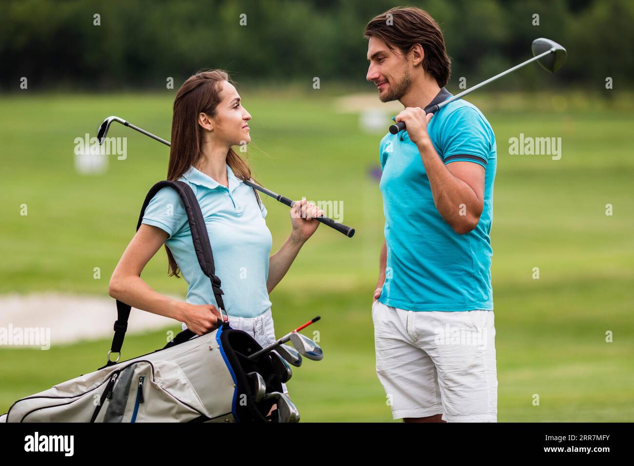 Front view fit friends playing golf Stock Photo - Alamy