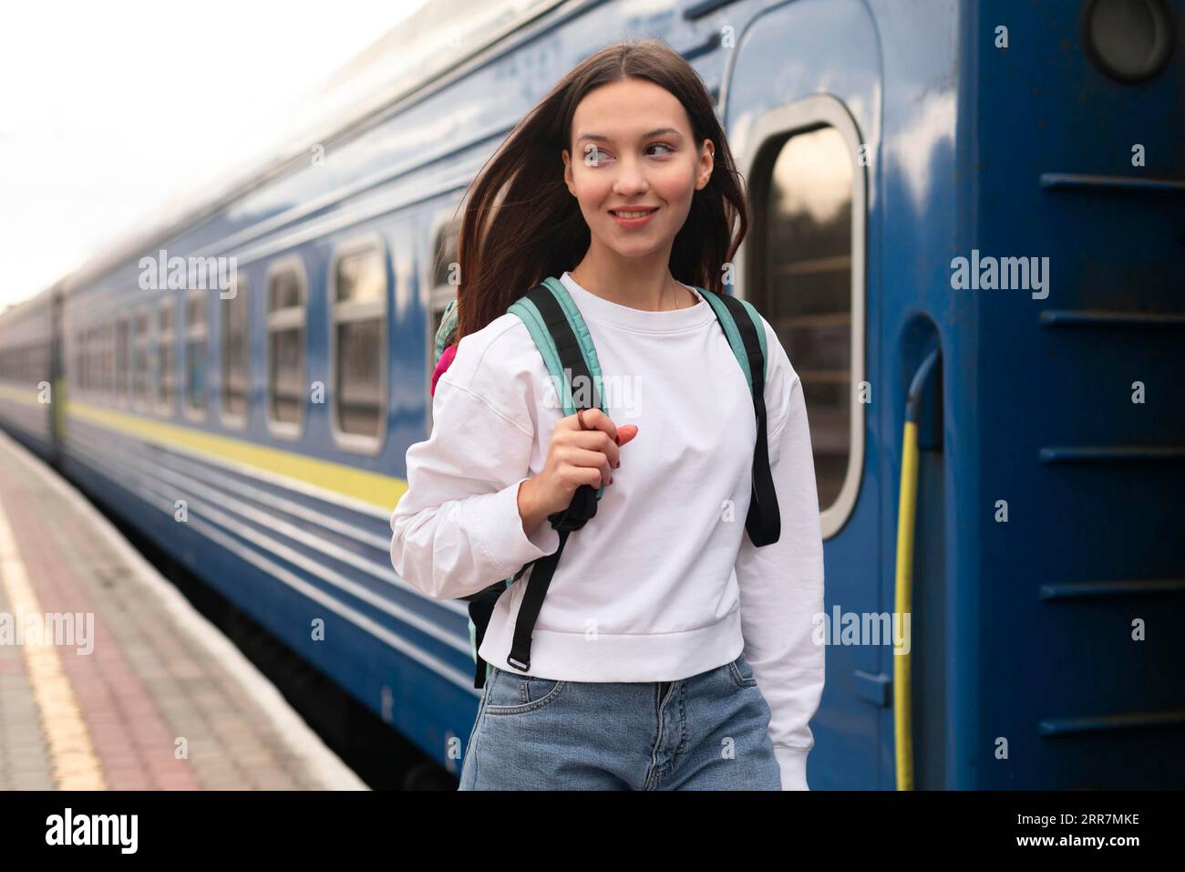 Girl on train station backpack hi-res stock photography and images - Alamy