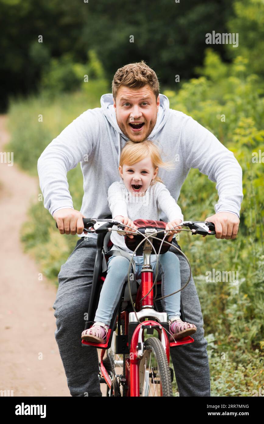 Happy father daughter bike Stock Photo - Alamy