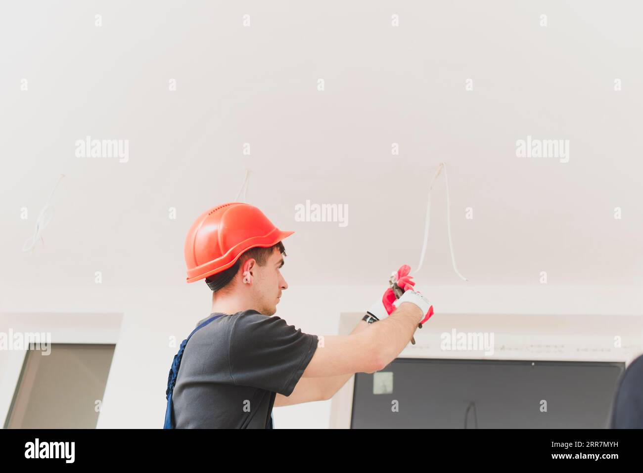 Worker fixing roof construction hi-res stock photography and images - Alamy