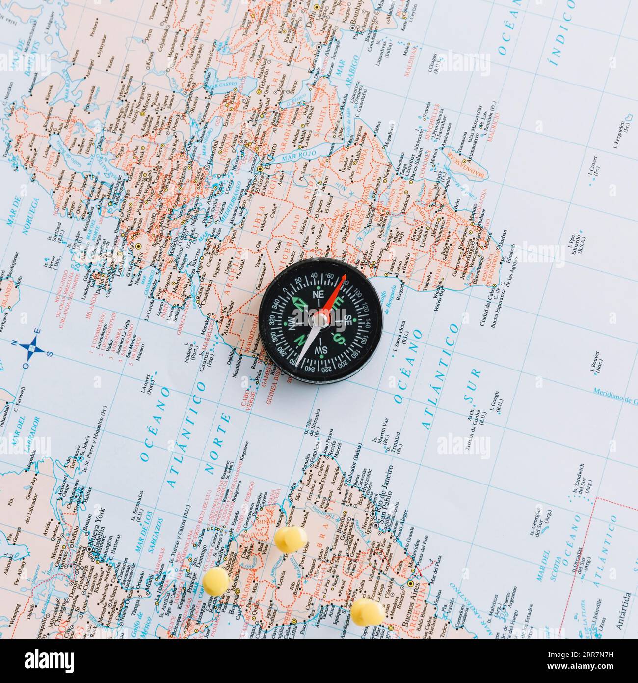 Overhead view compass world map Stock Photo - Alamy