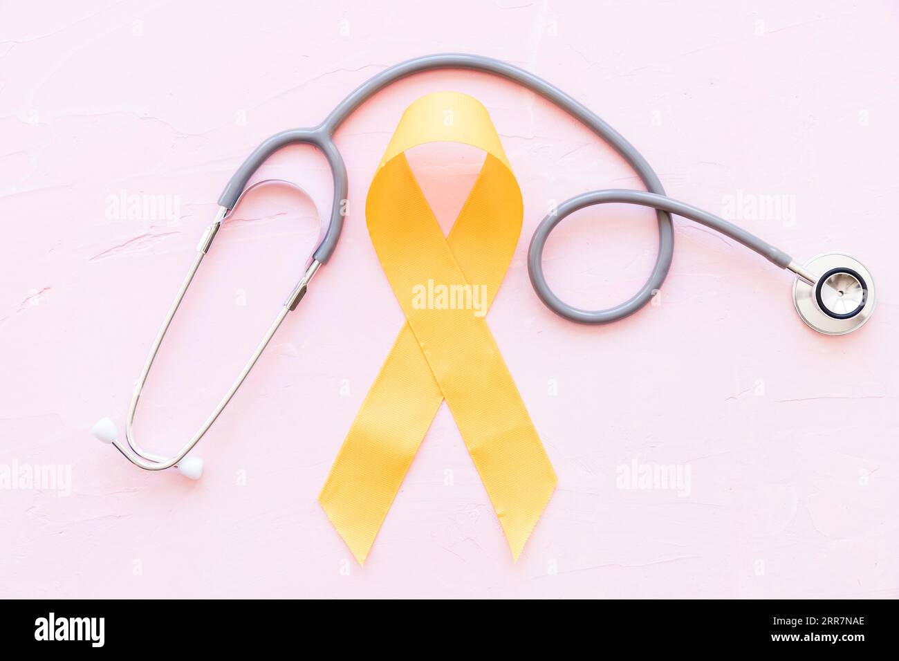 Sarcoma bone cancer yellow ribbon with stethoscope pink background ...