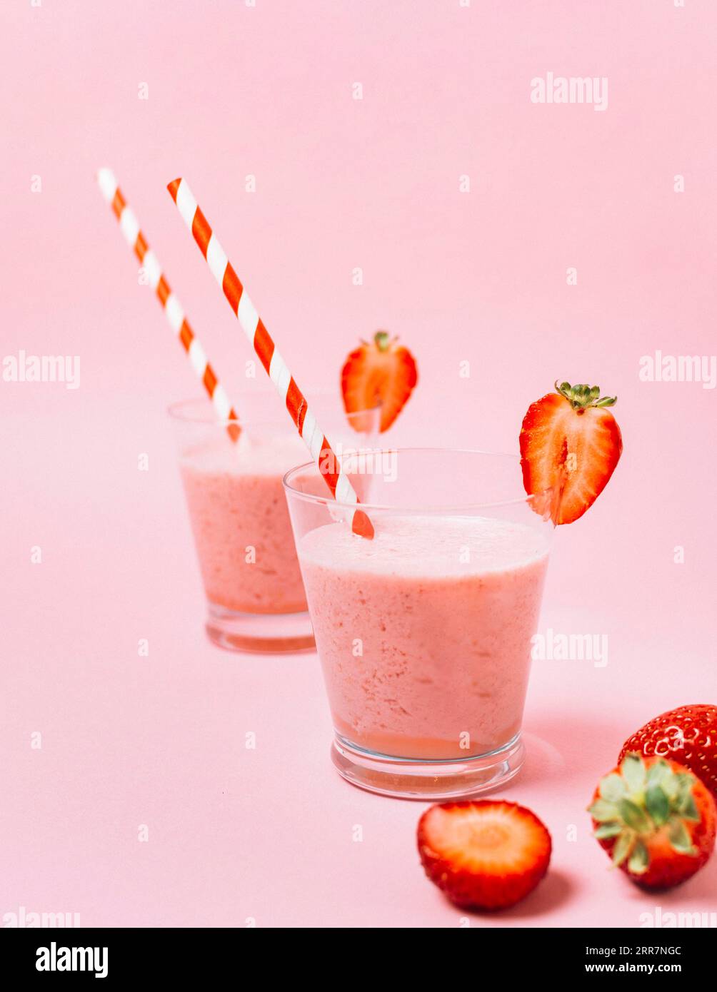 Strawberry smoothies with pink background Stock Photo - Alamy