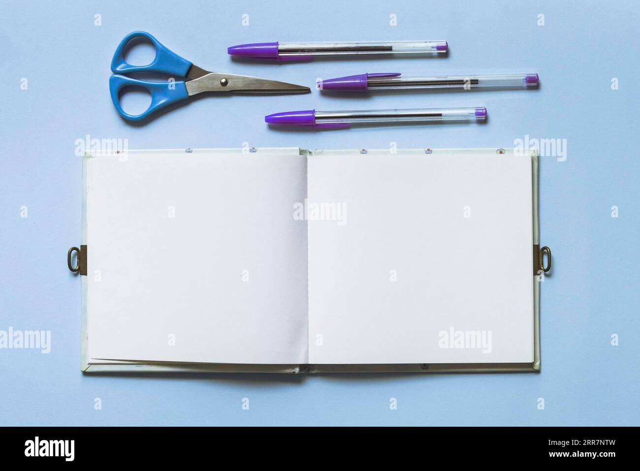 Writing accessories with pens sketchpad Stock Photo - Alamy