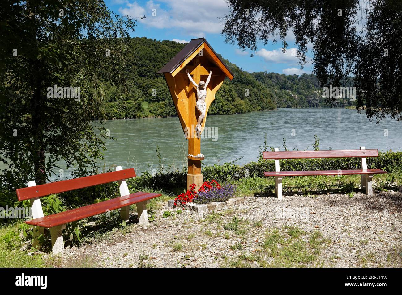 Wooden cross with Christ and roof, benches, bench opposite ...