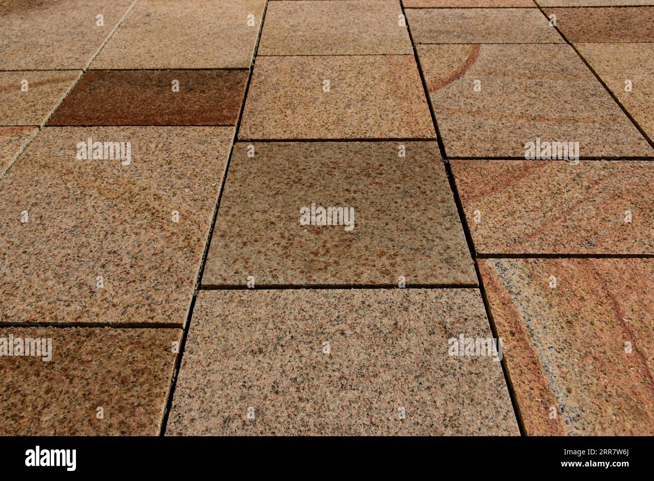 red brown stone paved sidewalk in diminishing perspective view. flat ...