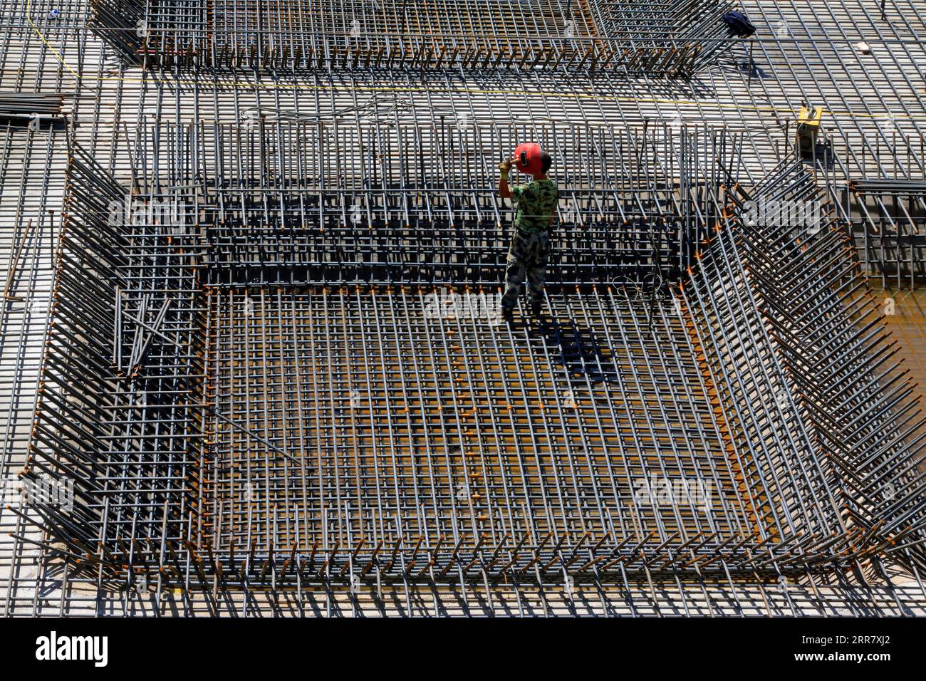 Construction workers making reinforced concrete frame in the ...