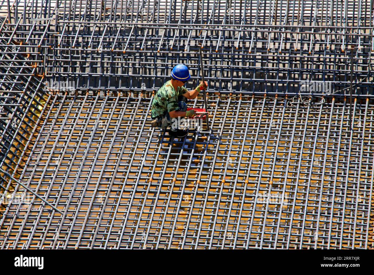 Construction workers making reinforced concrete frame in the ...