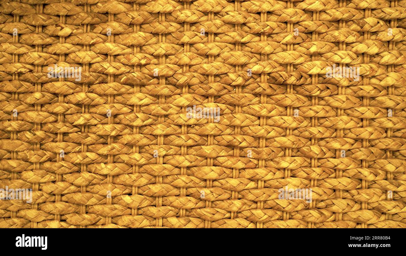 an intricately detailed rattan weave texture background Stock Photo - Alamy
