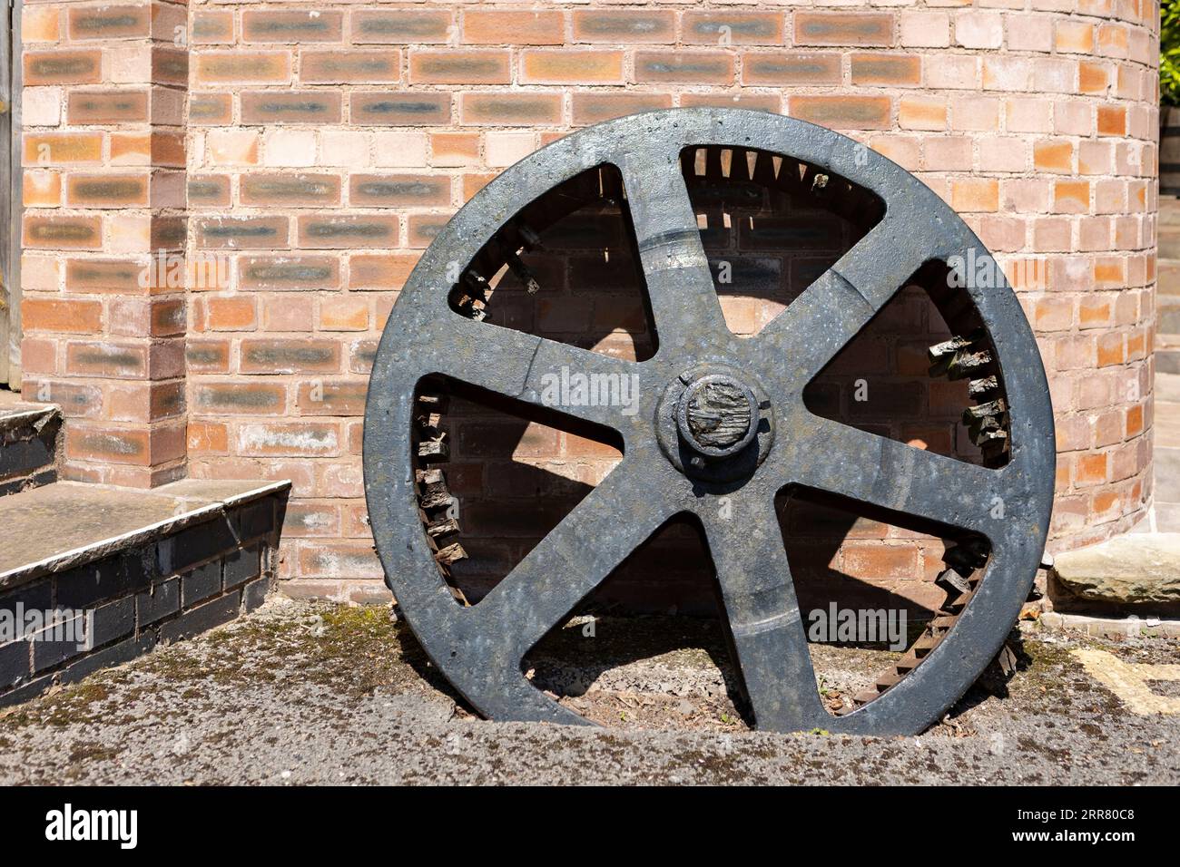Huge, rusting abandoned flywheel from a Victorian era lifting engine ...
