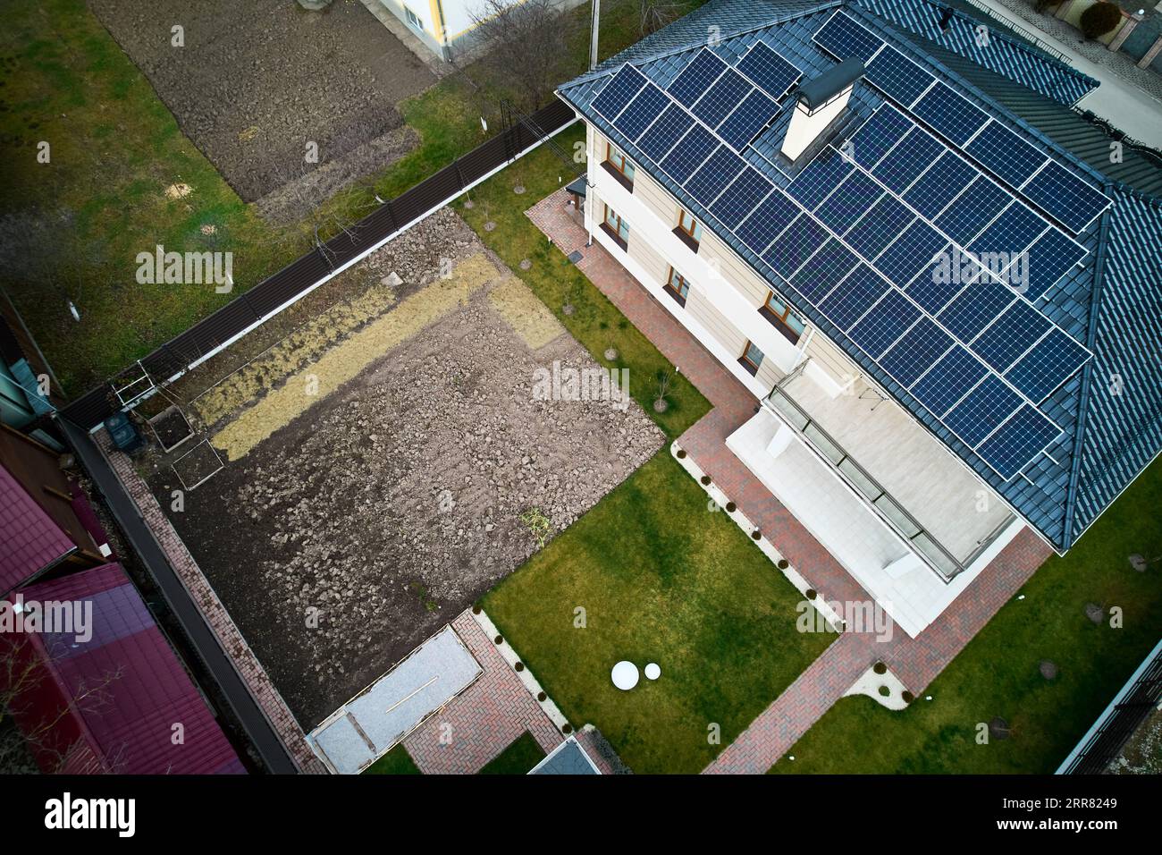 Aerial view of residential autonomous house with photovoltaic solar ...