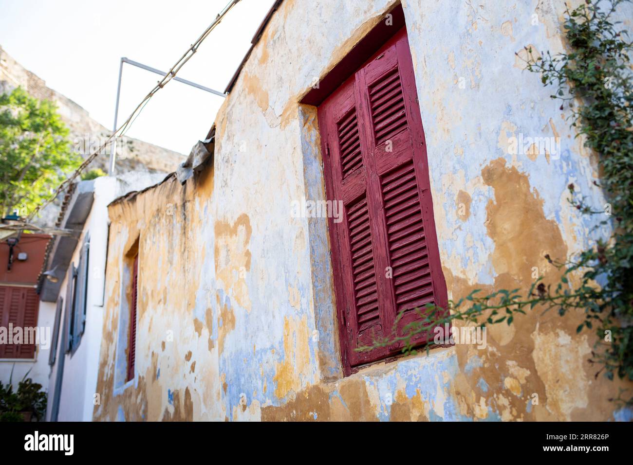 Old rusty and rubble wall in Plaka district, Athens, Greece Stock Photo ...