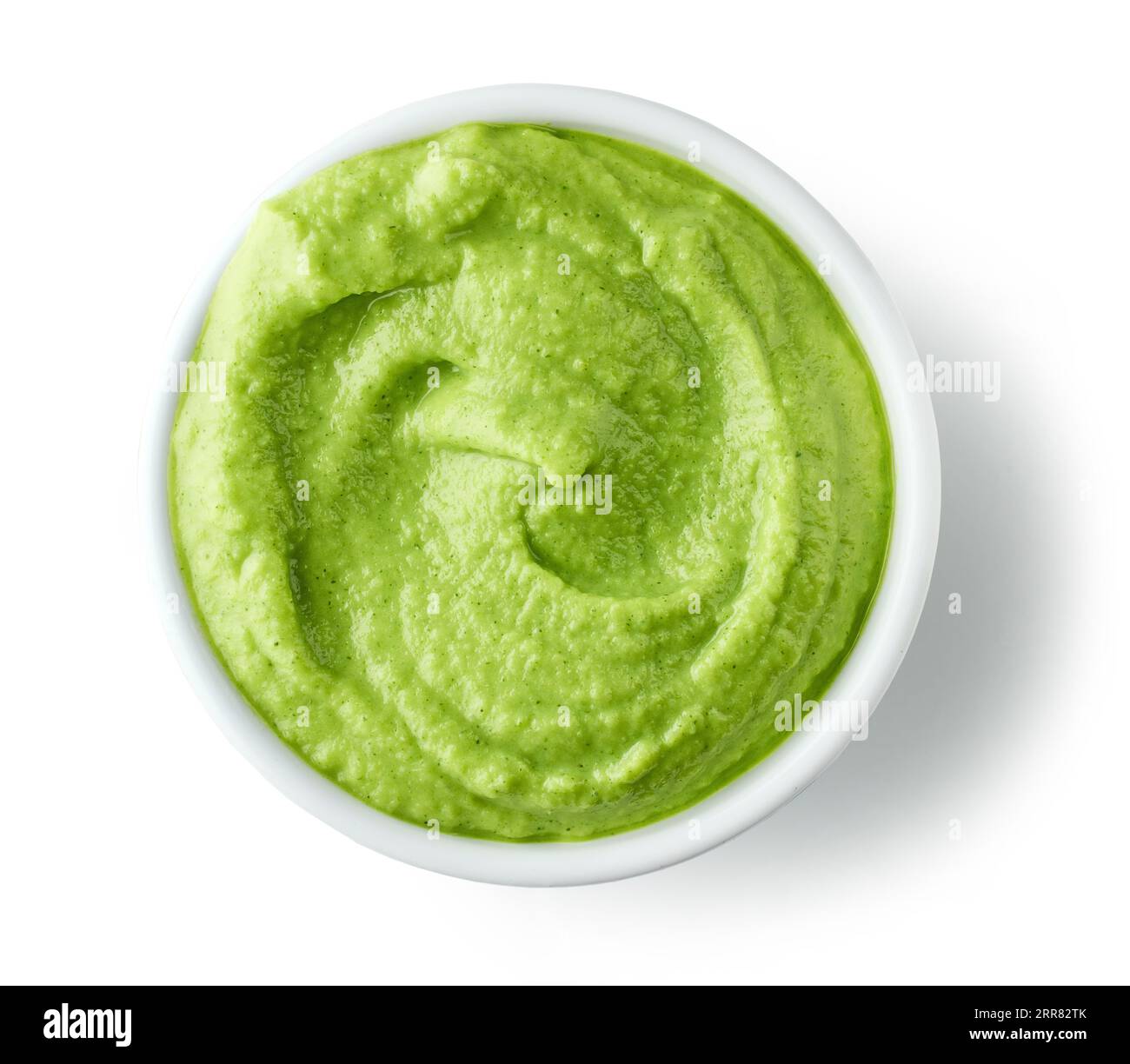 bowl of green vegetable puree isolated on white background, top view ...