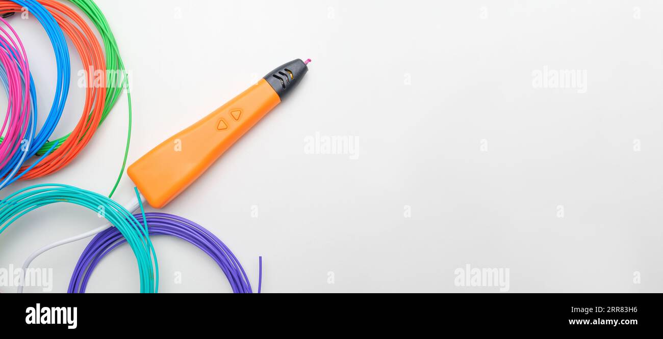 3d Pen. Printing with Colored Plastic Wire Filament. Child making a ...