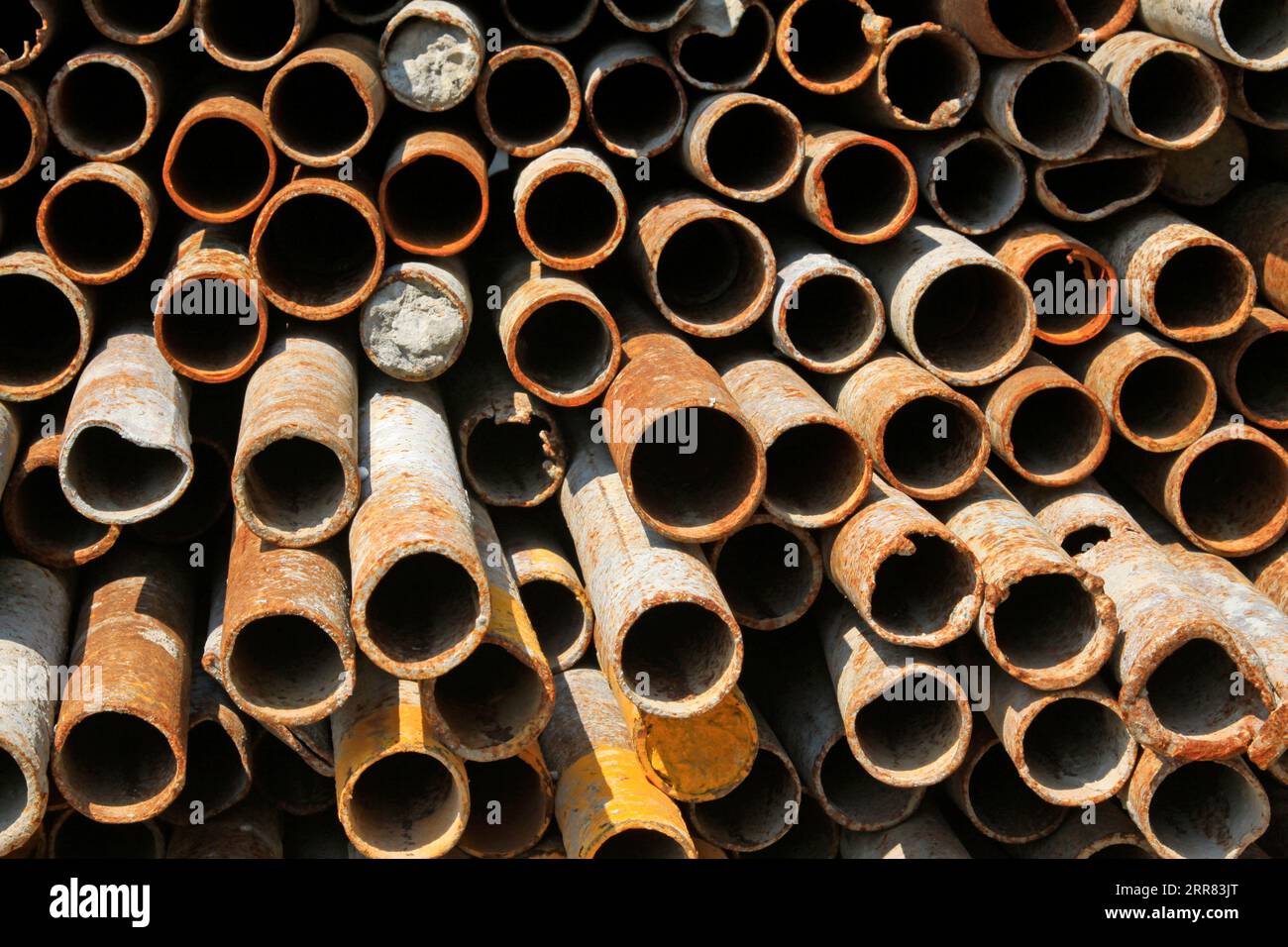 Rust deformation steel pipe in the construction site Stock Photo - Alamy