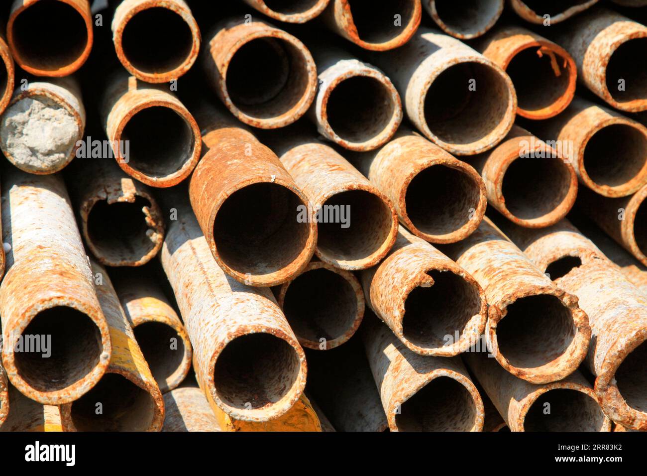 Rust deformation steel pipe in the construction site Stock Photo - Alamy