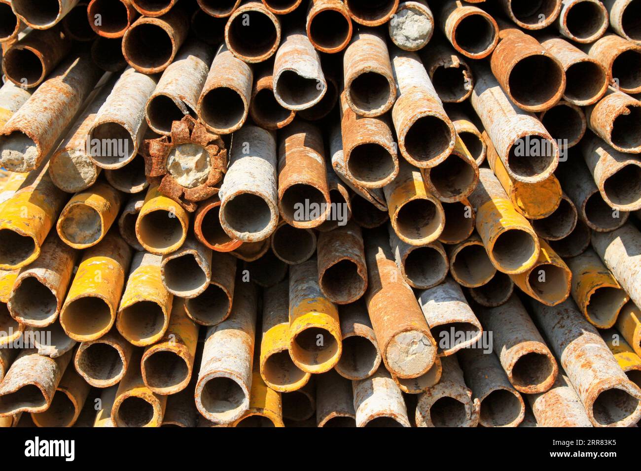 Rust deformation steel pipe in the construction site Stock Photo - Alamy