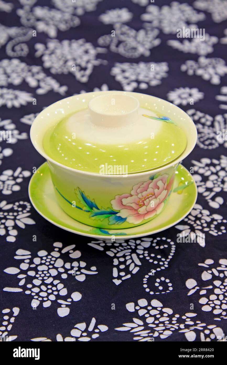 Ceramic tea set on the batik fabrics Stock Photo - Alamy