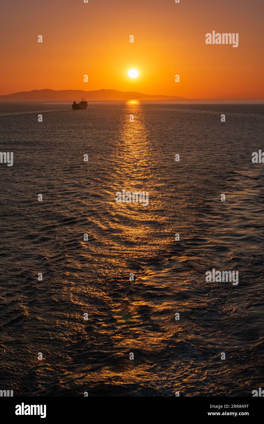 Beautiful orange sunset over waves hi-res stock photography and images ...