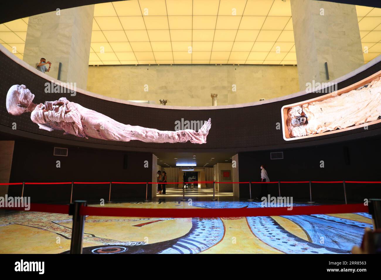 210418 -- CAIRO, April 18, 2021 -- People visit the Royal Mummies Hall ...