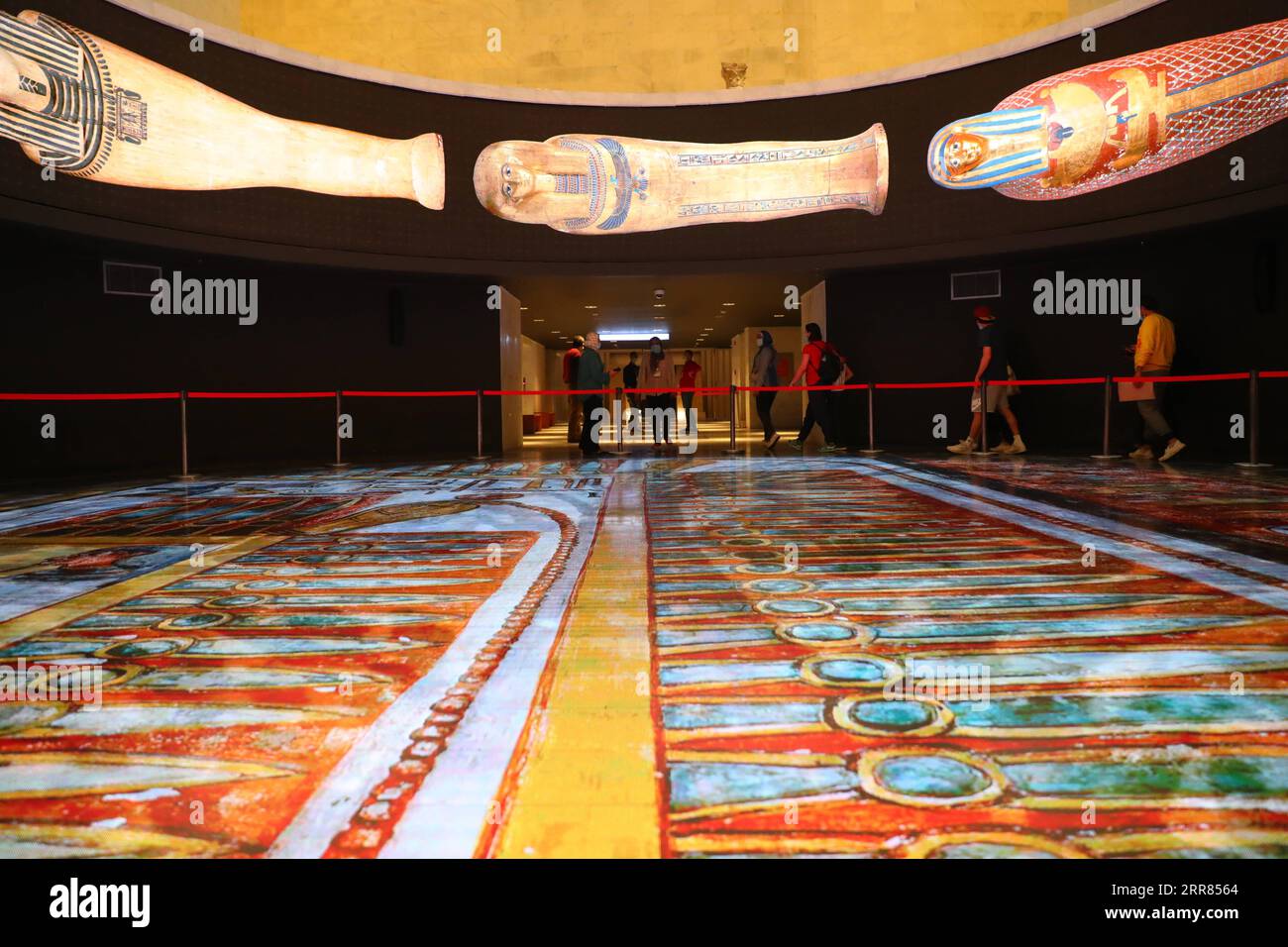 210418 -- CAIRO, April 18, 2021 -- People visit the Royal Mummies Hall ...