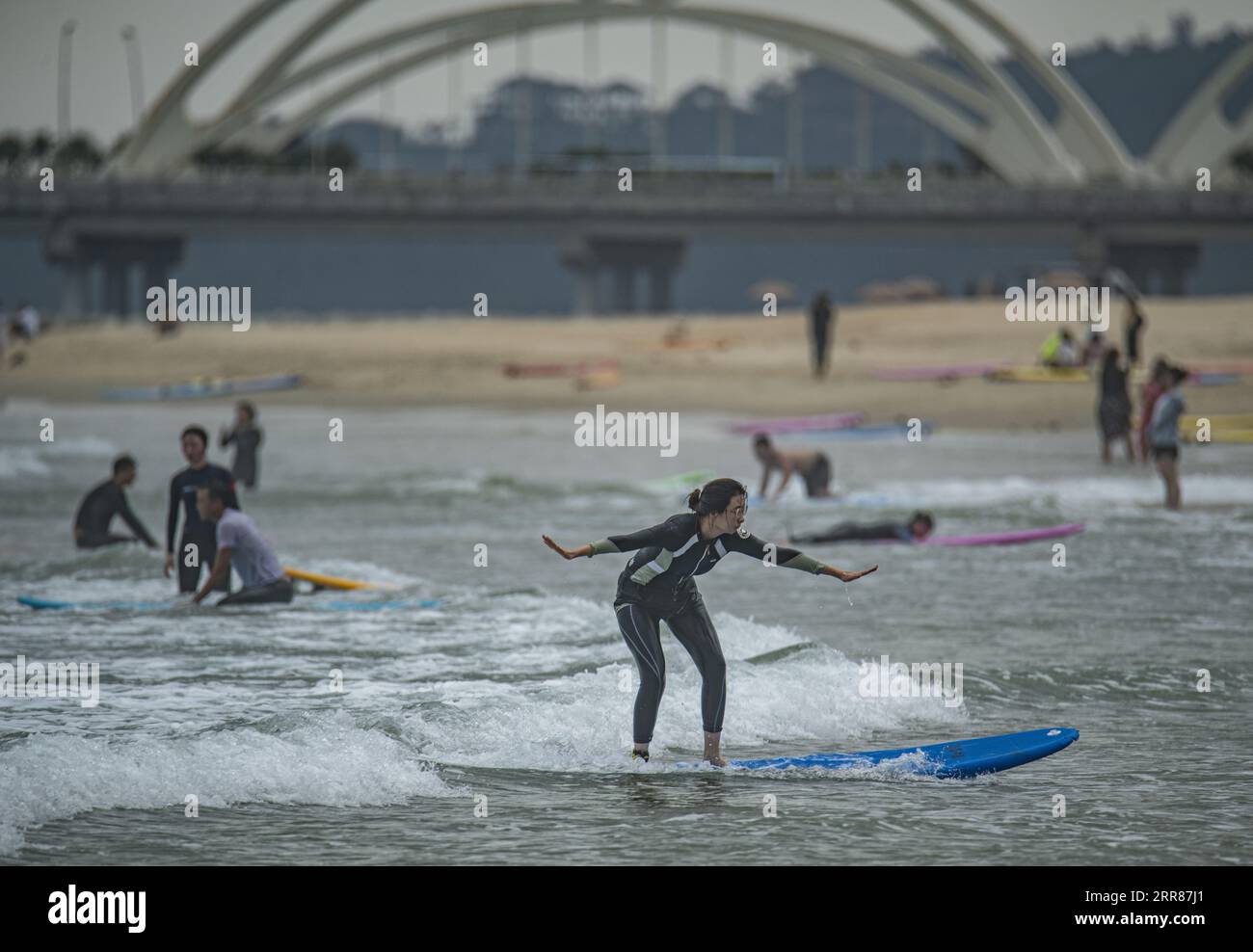 People enjoy fun of surfing in the sea in Wanning City, southernmost ...