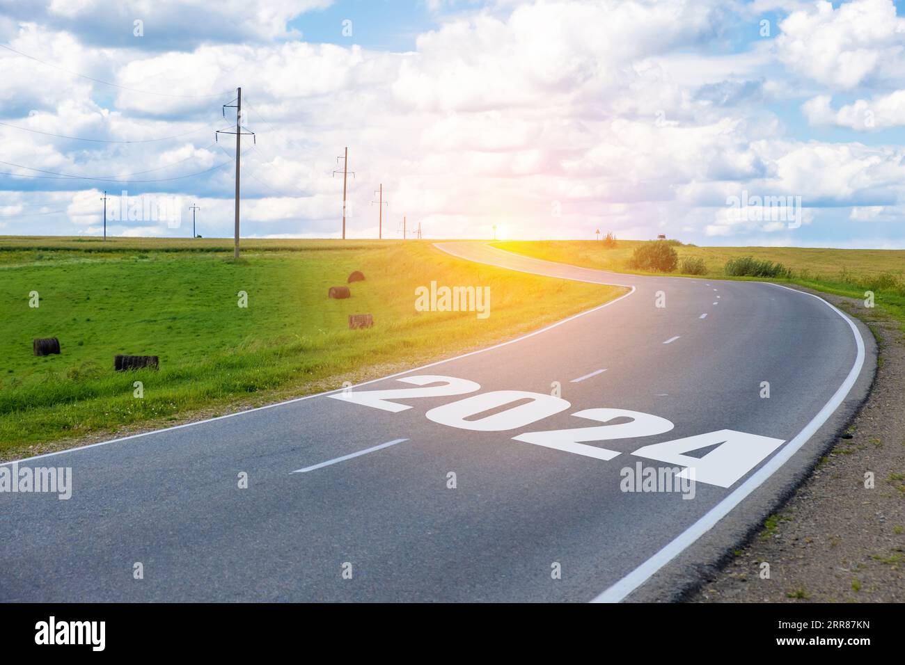 2024 written on highway road in the middle of empty asphalt road Stock ...
