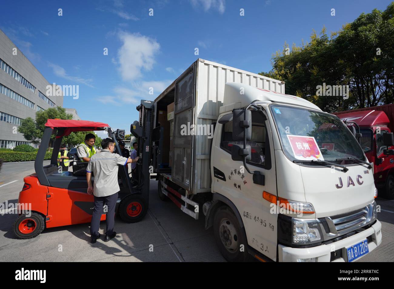 The torch for the 19th Asian Games makes its debut at a delivery ...