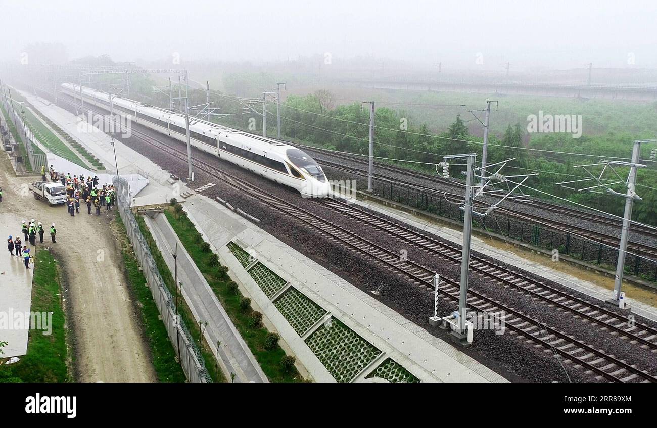 210427 -- HEFEI, April 27, 2021 -- Aerial photo shows a bullet train ...