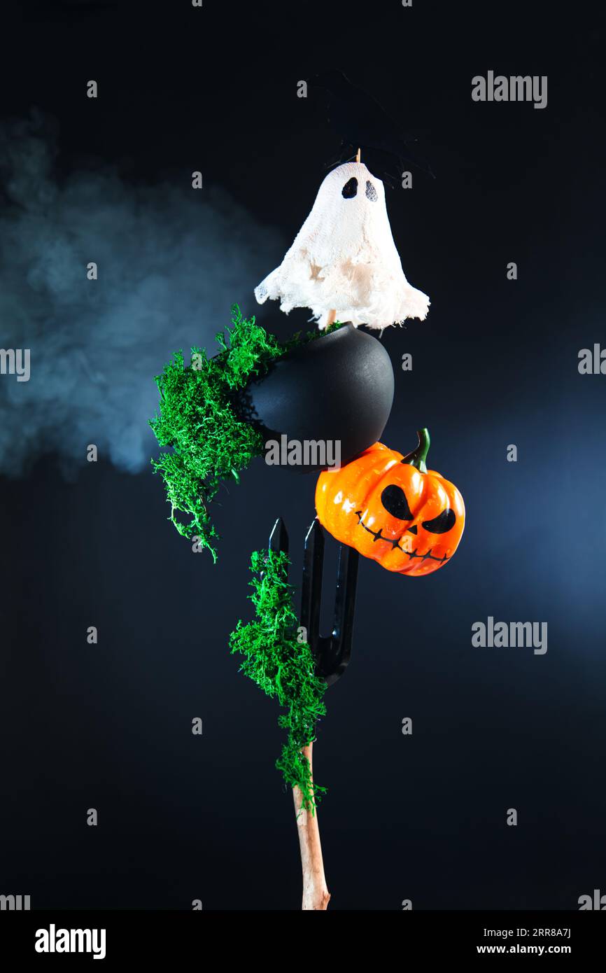 Balancing composition - pitchfork, jack-o'-lantern, ghost and raven ...