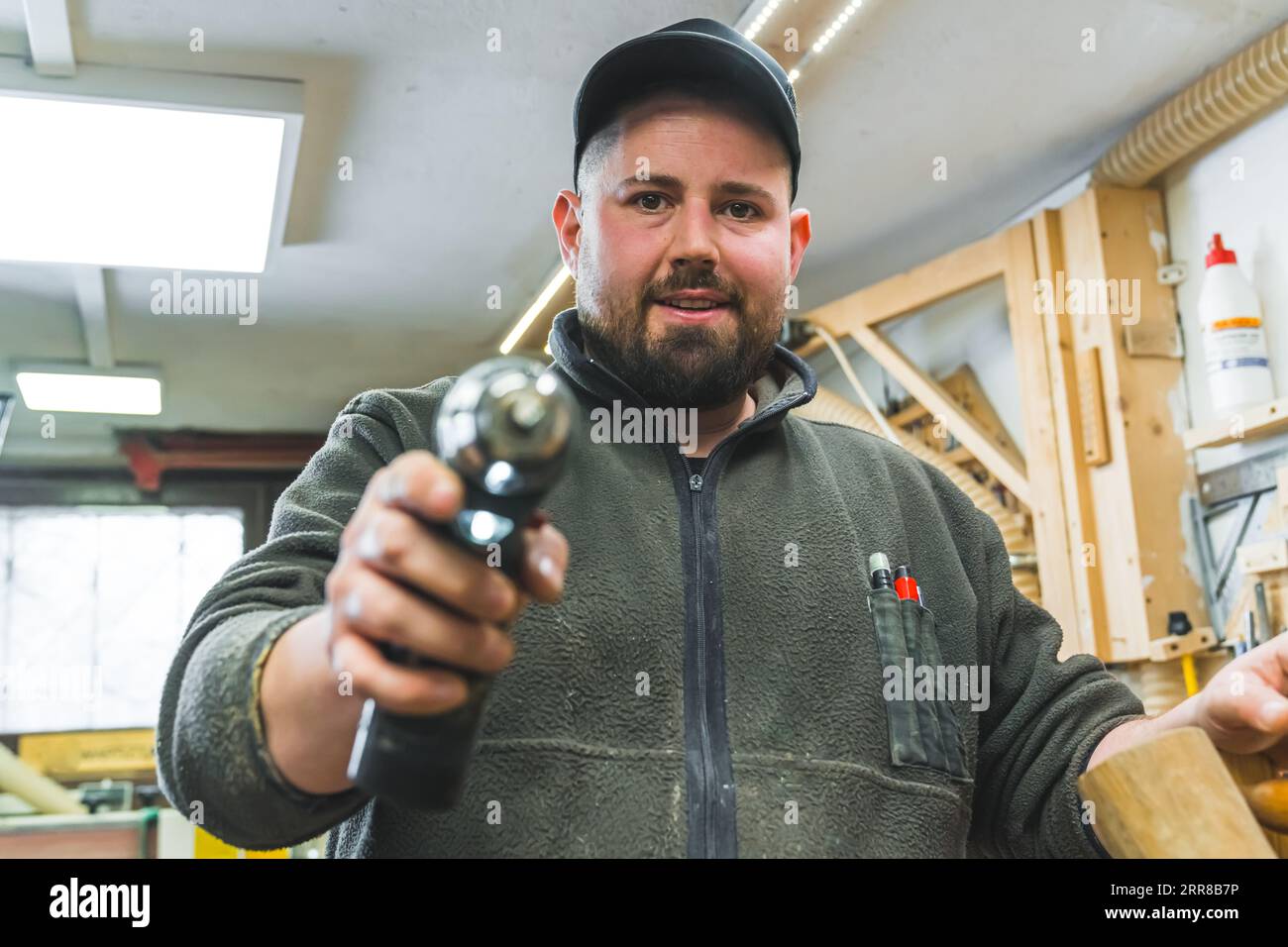 Man woodworker pointing power drill at the camera . High quality photo ...