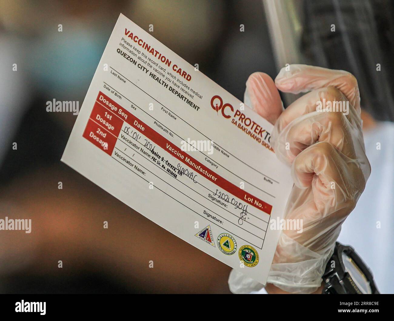 210501 -- MANILA, May 1, 2021 -- A health worker shows a vaccination ...