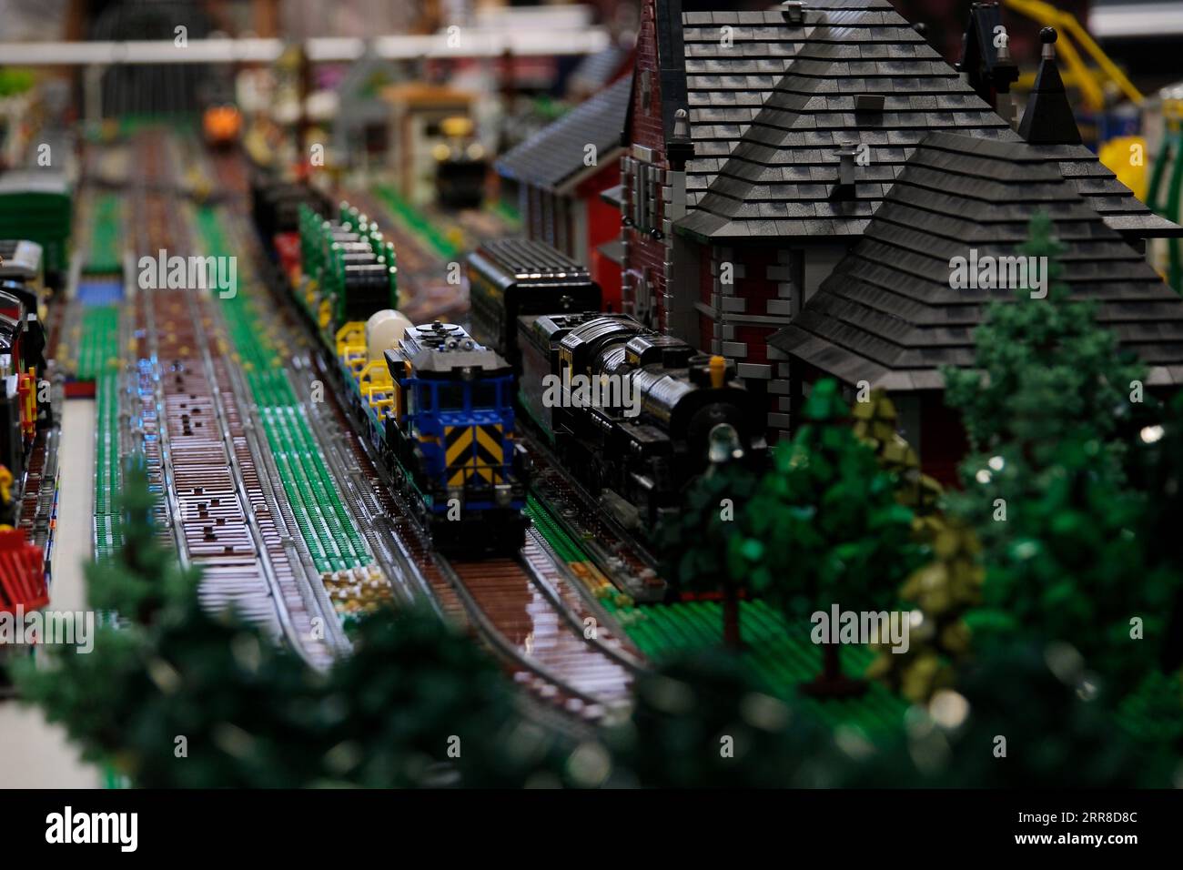 a city completely made of Lego blocks houses cars streets trains trams ...