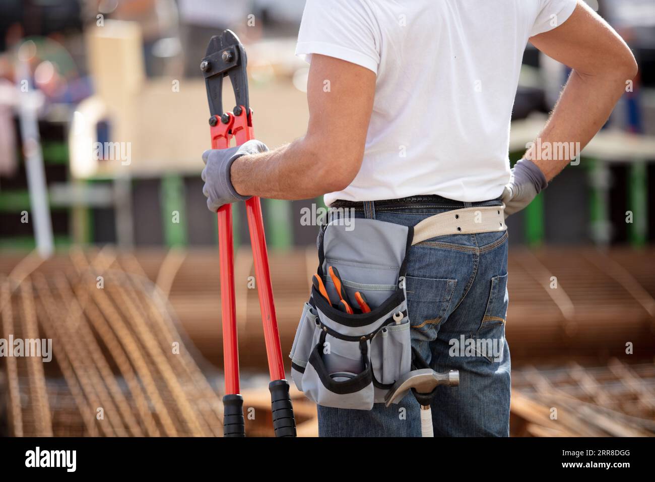 construction site worker wearing velt with tools Stock Photo - Alamy
