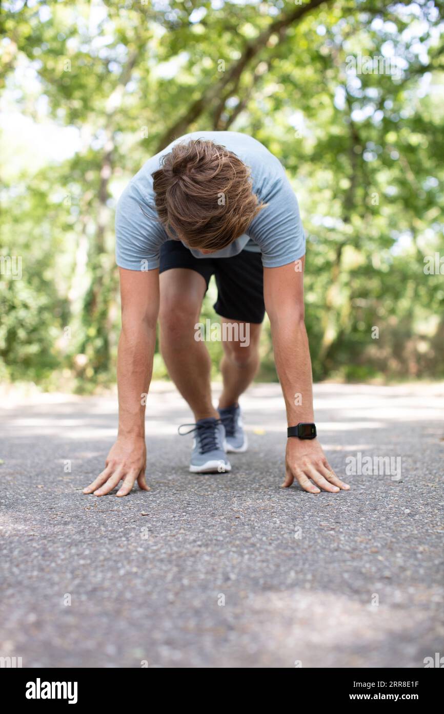 Male athlete on starting blocks hi-res stock photography and images - Alamy